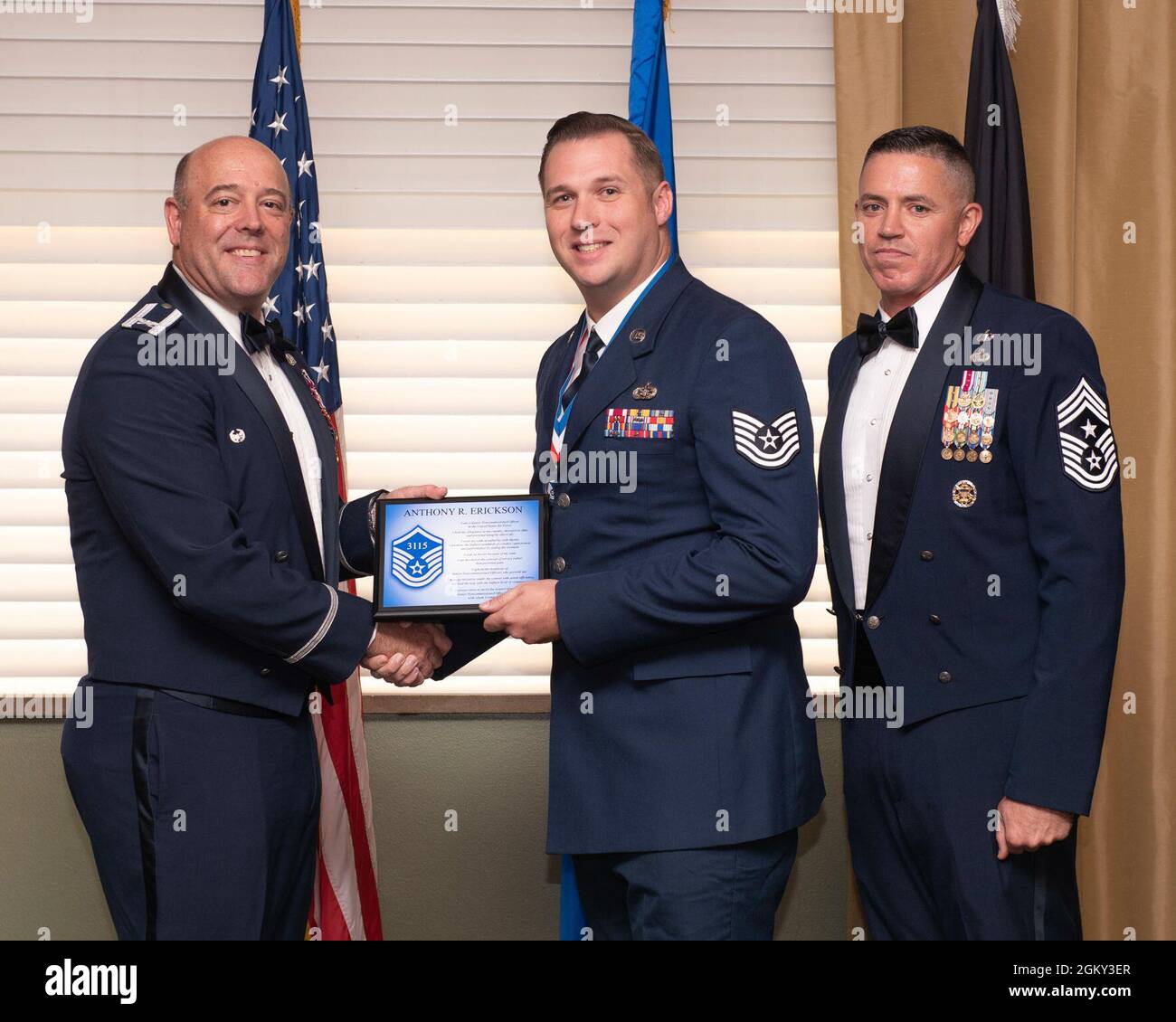 A promotee poses for a photo with Col. Patrick Miller, 88th Air Base ...