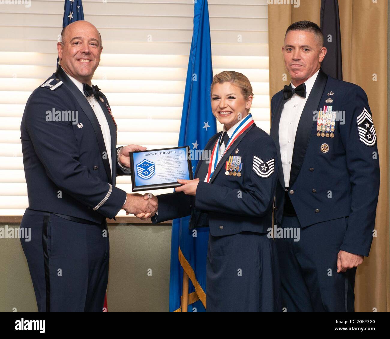 A promotee poses for a photo with Col. Patrick Miller, 88th Air Base ...