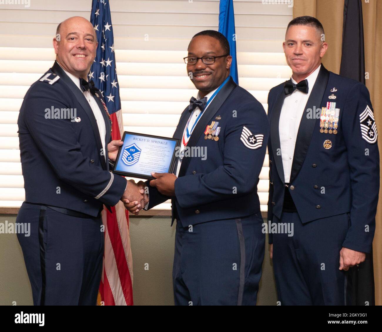 A promotee poses for a photo with Col. Patrick Miller, 88th Air Base ...