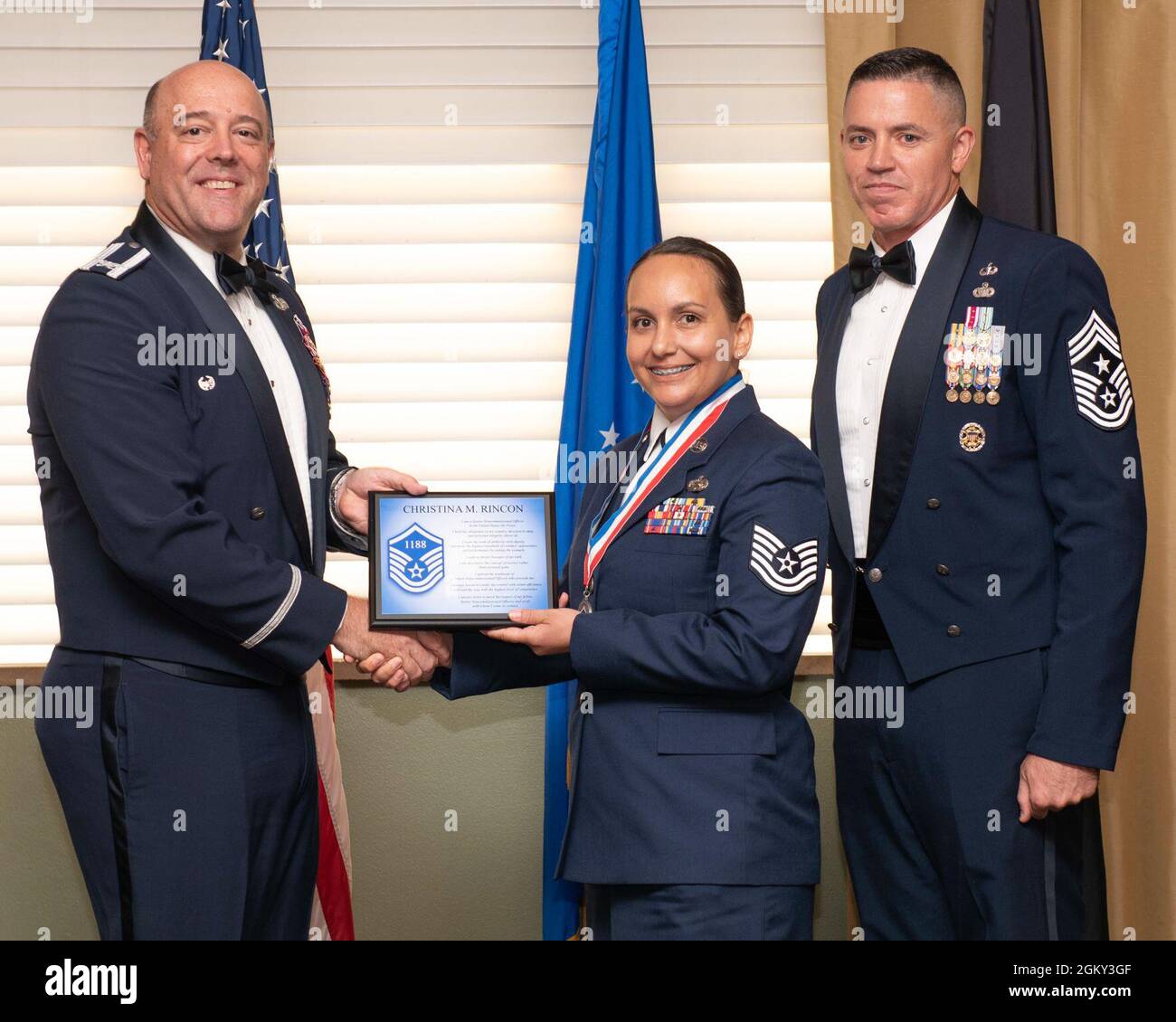 A promotee poses for a photo with Col. Patrick Miller, 88th Air Base ...