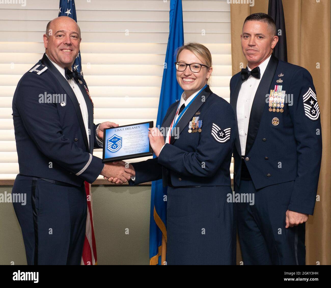 A promotee poses for a photo with Col. Patrick Miller, 88th Air Base ...