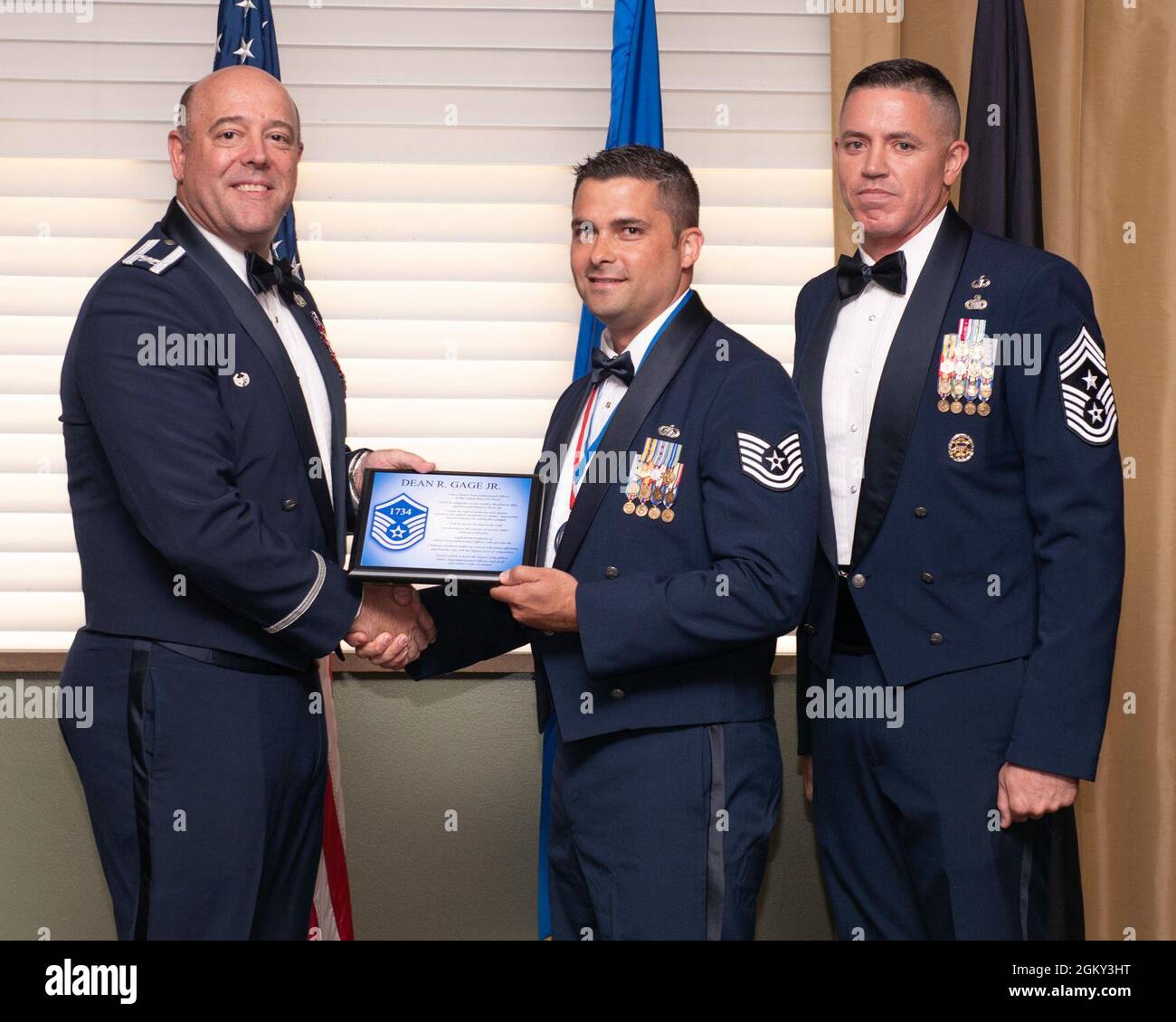 A promotee poses for a photo with Col. Patrick Miller, 88th Air Base ...
