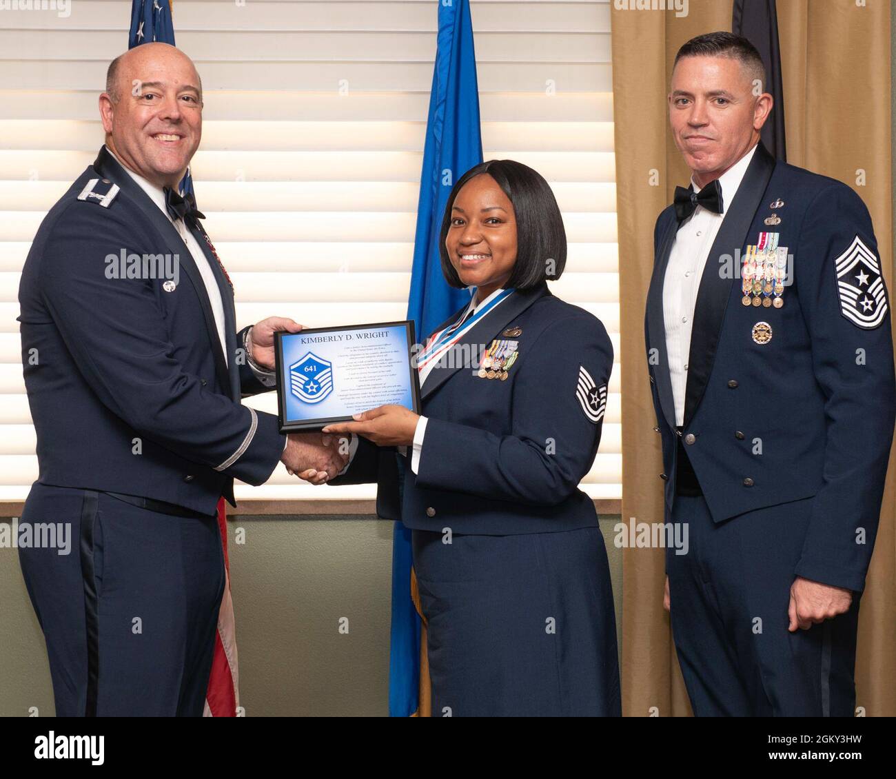 A promotee poses for a photo with Col. Patrick Miller, 88th Air Base ...