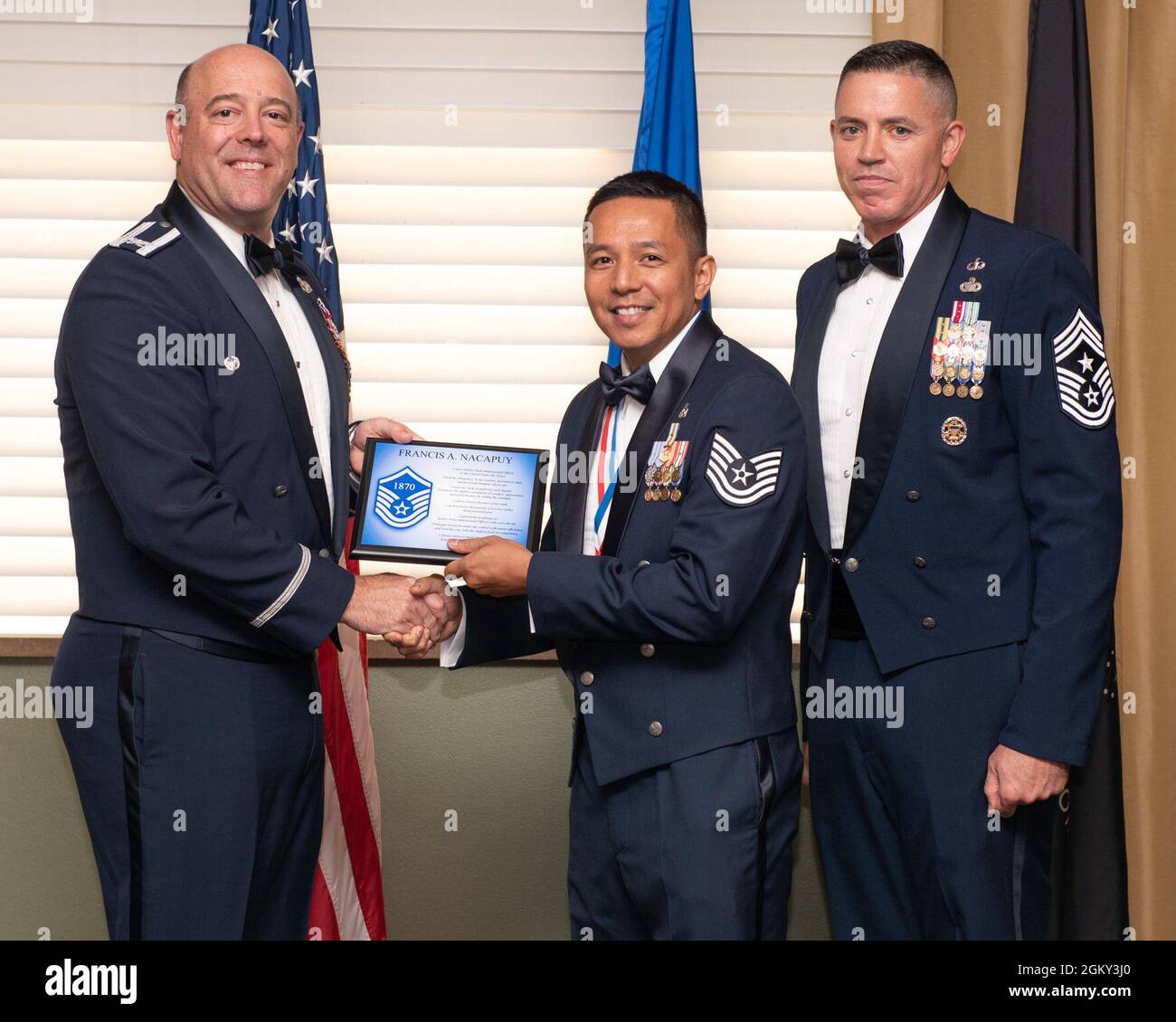 A promotee poses for a photo with Col. Patrick Miller, 88th Air Base ...