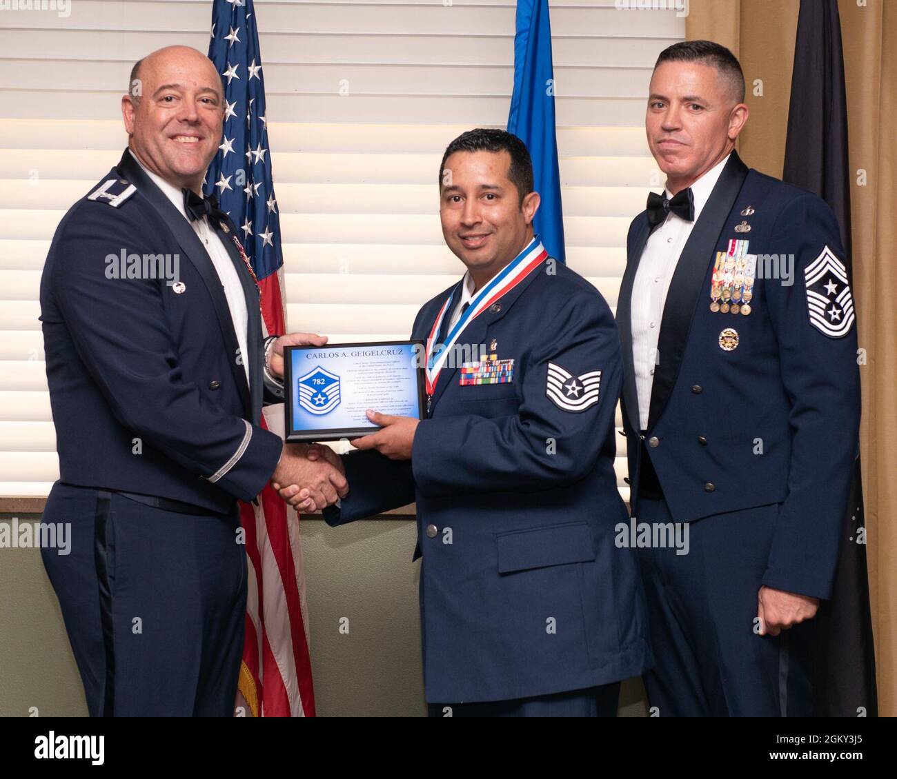 A promotee poses for a photo with Col. Patrick Miller, 88th Air Base ...