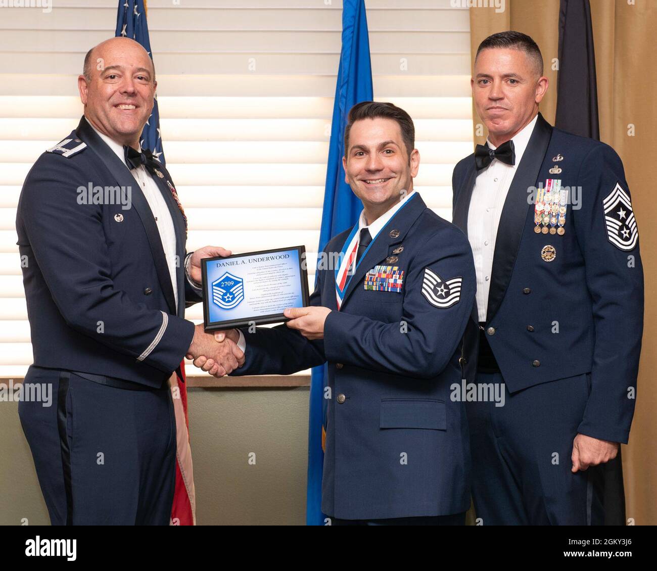 A promotee poses for a photo with Col. Patrick Miller, 88th Air Base ...