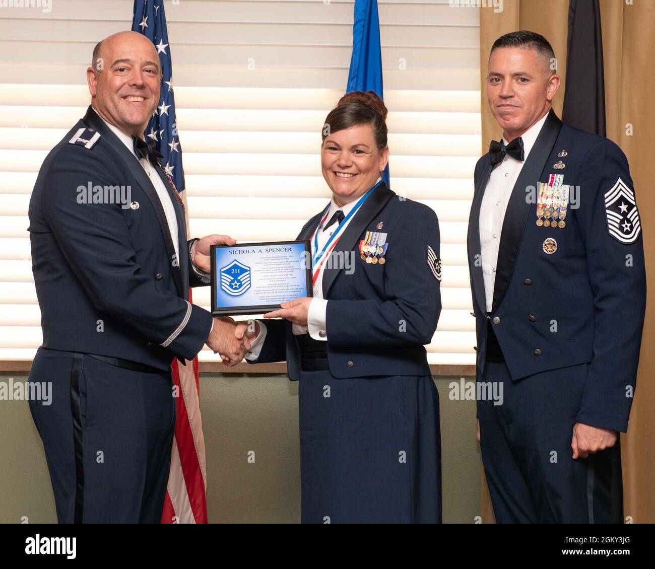 A promotee poses for a photo with Col. Patrick Miller, 88th Air Base ...