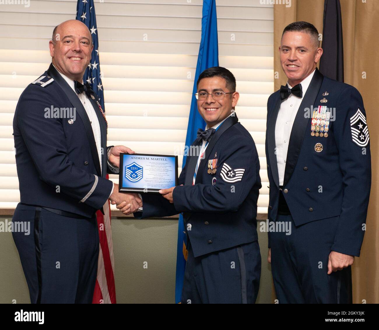 A promotee poses for a photo with Col. Patrick Miller, 88th Air Base ...