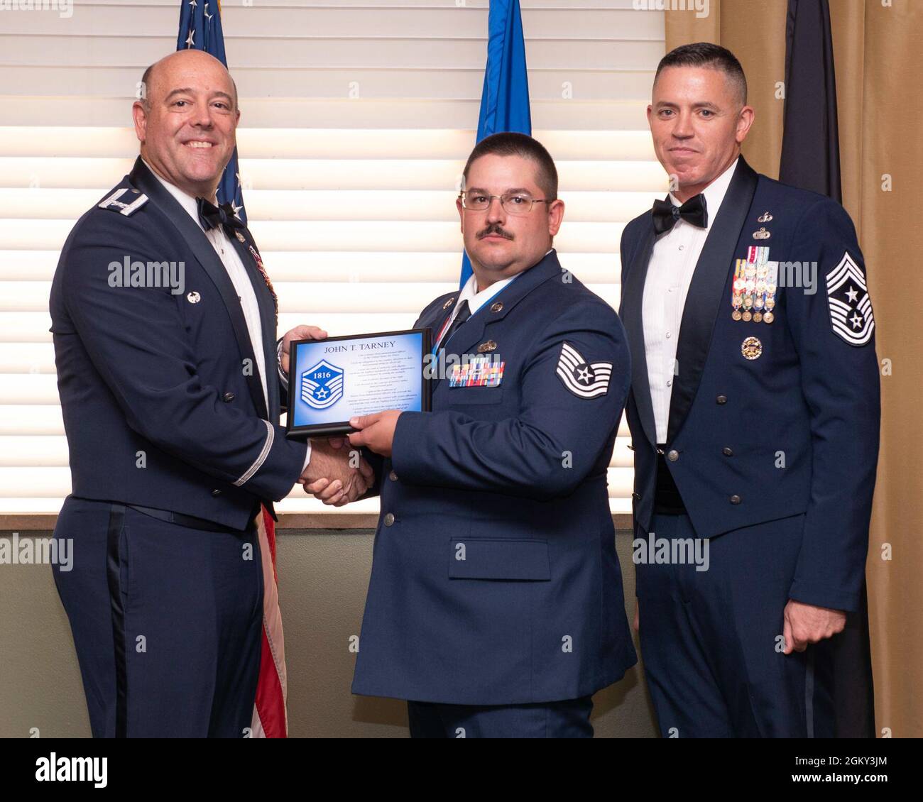 A promotee poses for a photo with Col. Patrick Miller, 88th Air Base ...
