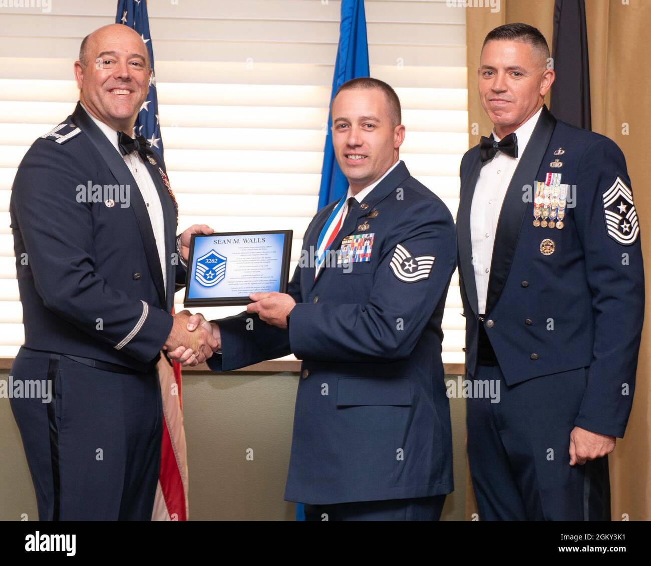 A promotee poses for a photo with Col. Patrick Miller, 88th Air Base ...