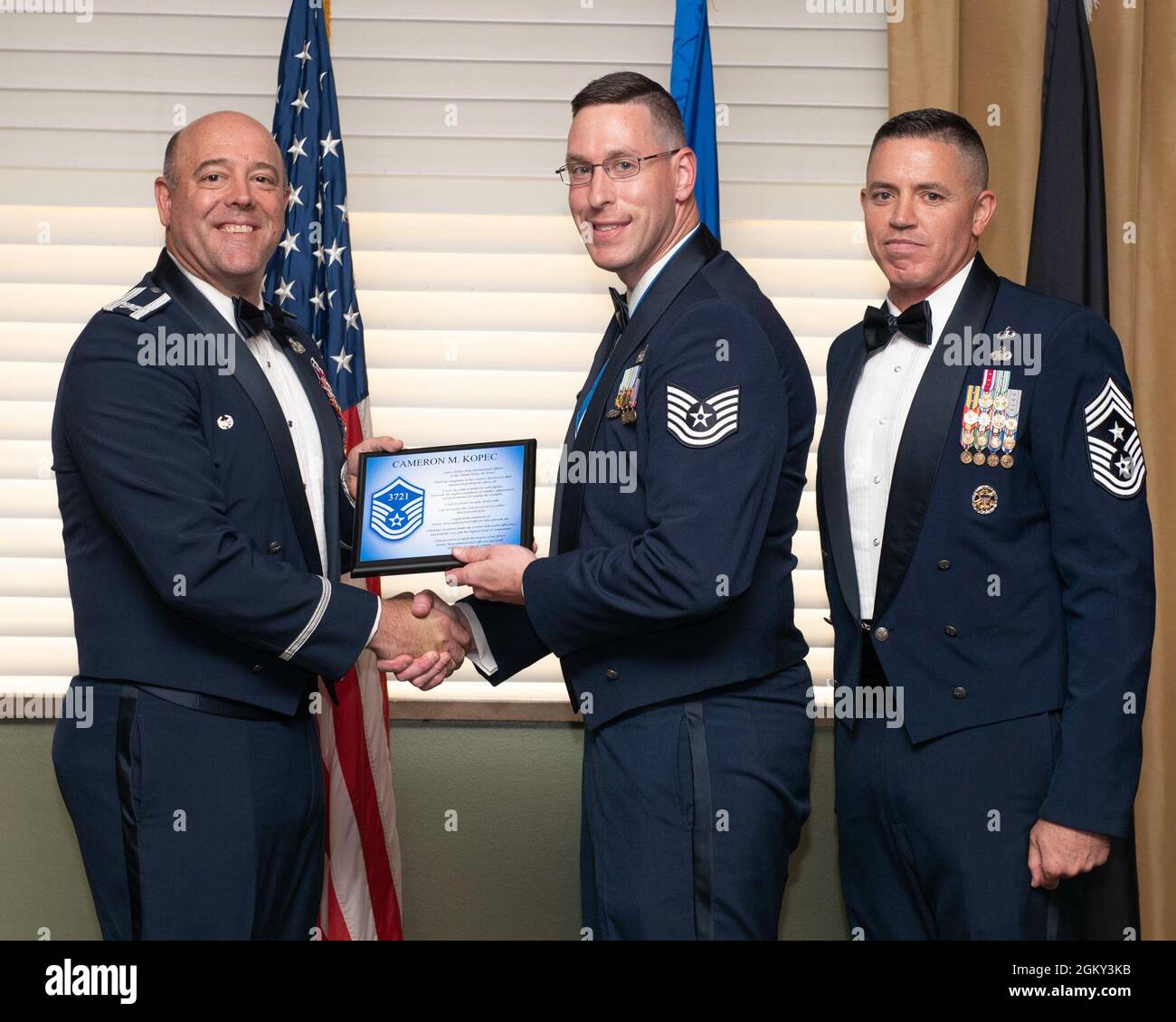 A promotee poses for a photo with Col. Patrick Miller, 88th Air Base ...