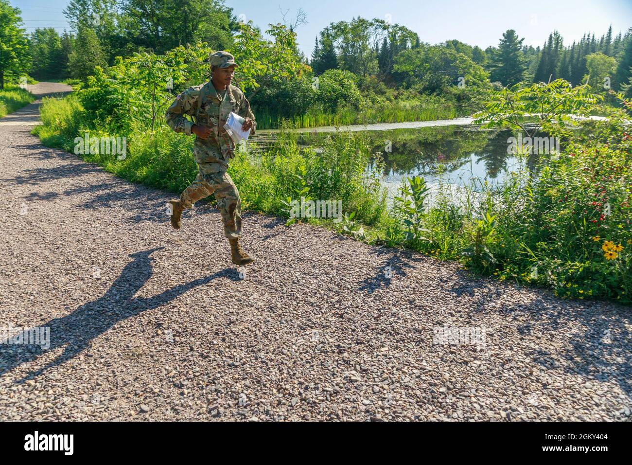 Sgt. Stanley Thompson, 108th Training Command, runs to his next point ...