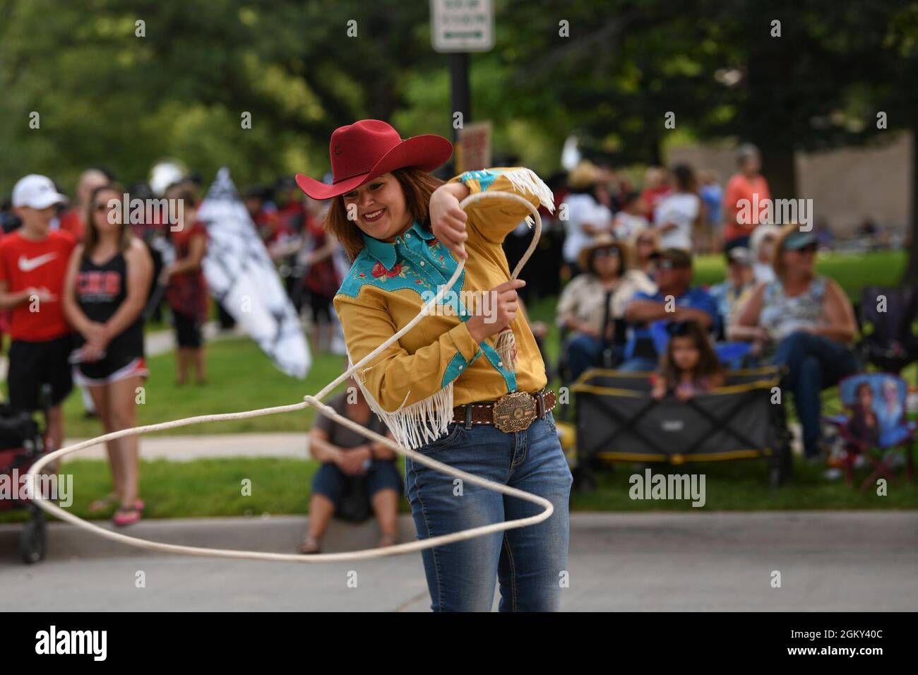 A cowgirl roper performs lasso tricks during the Cheyenne Frontier Days ...