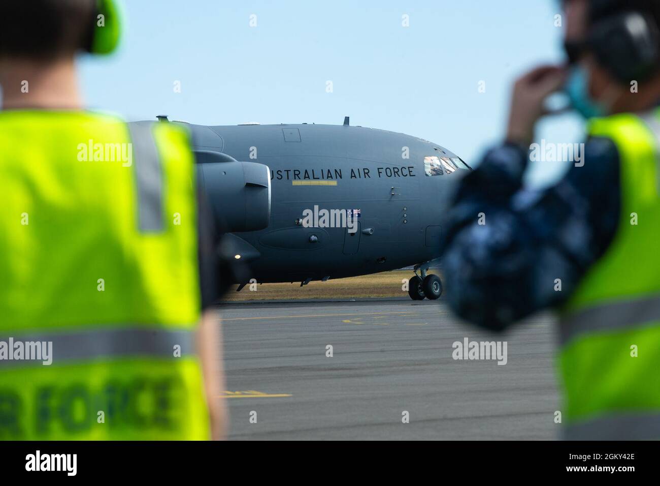 Australian Defence Force personnel from 36th Squadron prepare to load ...