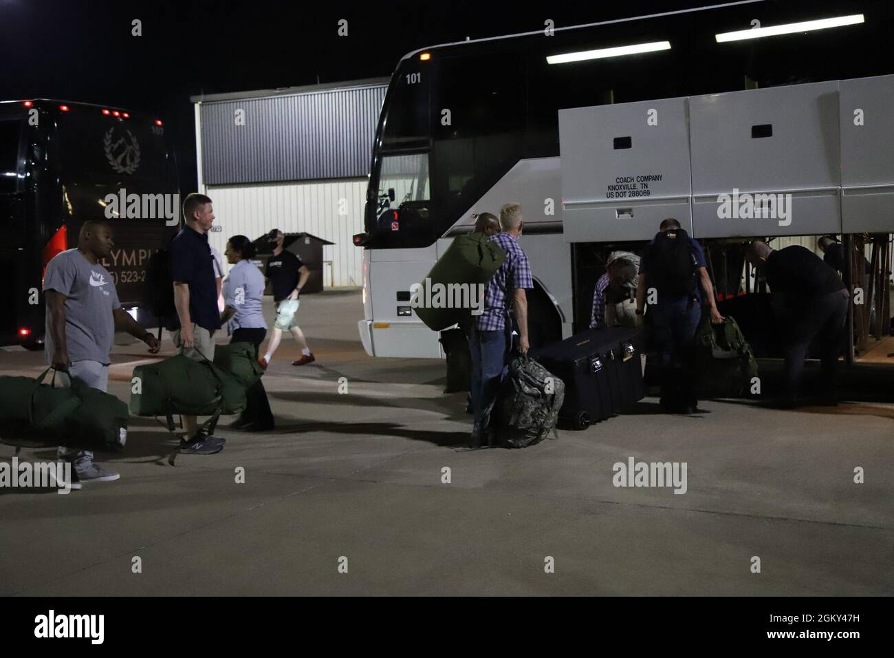 U.S. Army V Corps Soldiers loading the busses in the morning before ...