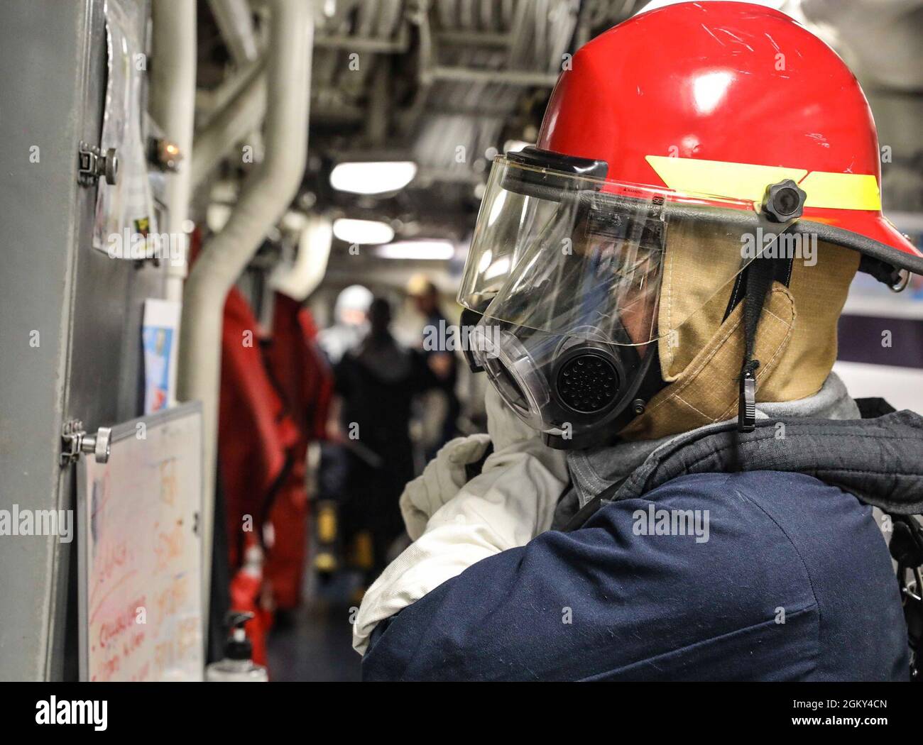 Engineman 2nd Class James Macias, from Fresno, Calif., dresses out in ...