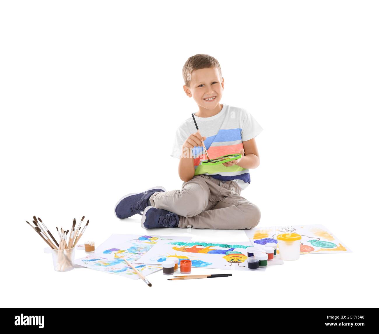 Talented boy painting against white background Stock Photo - Alamy
