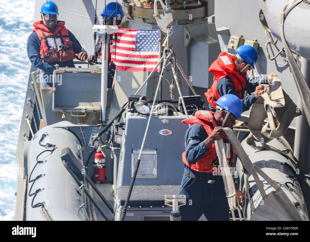 SOUTH CHINA SEA (July 25, 2021) Sailors prepare to lower a rigid-hull ...