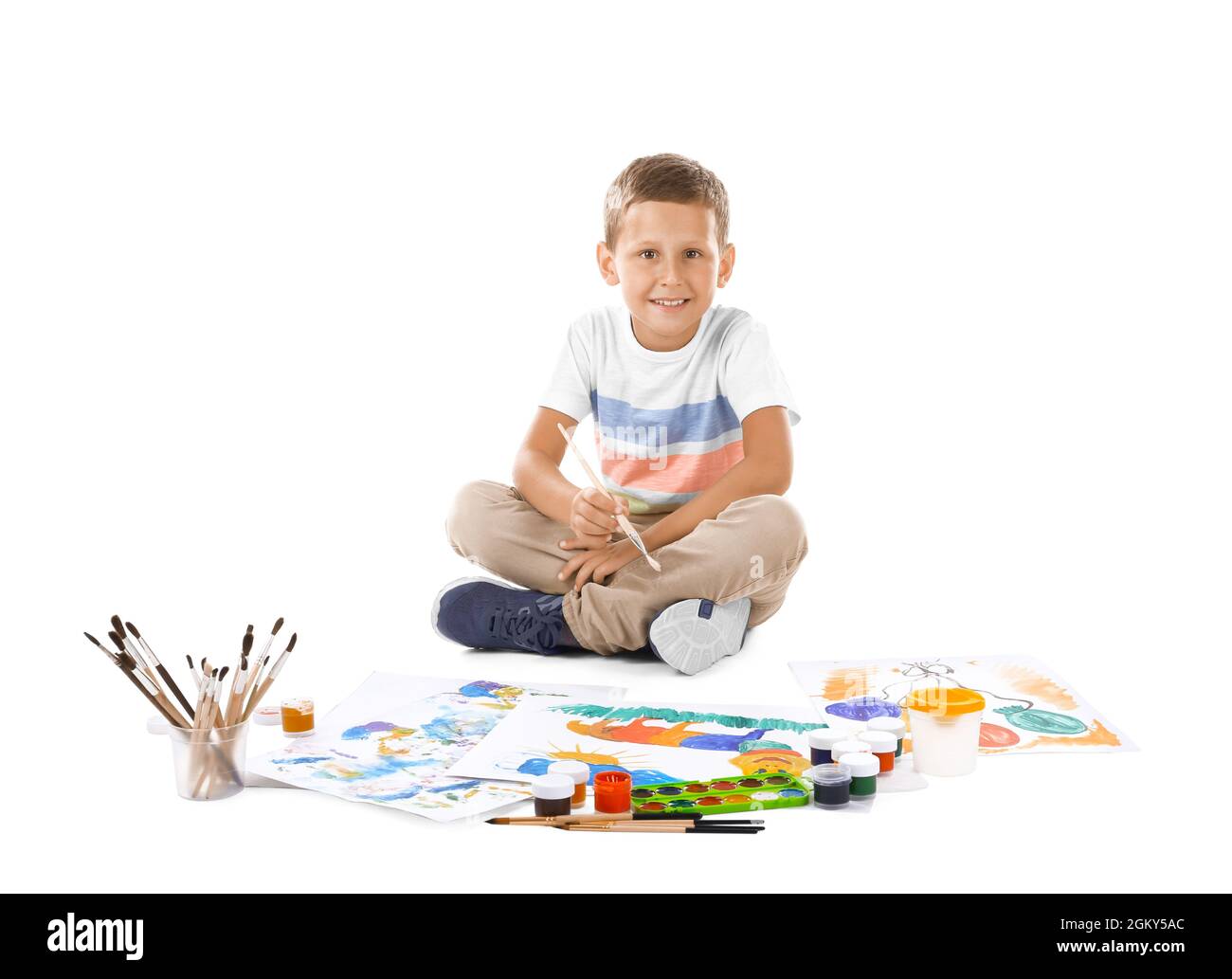 Talented boy painting against white background Stock Photo - Alamy