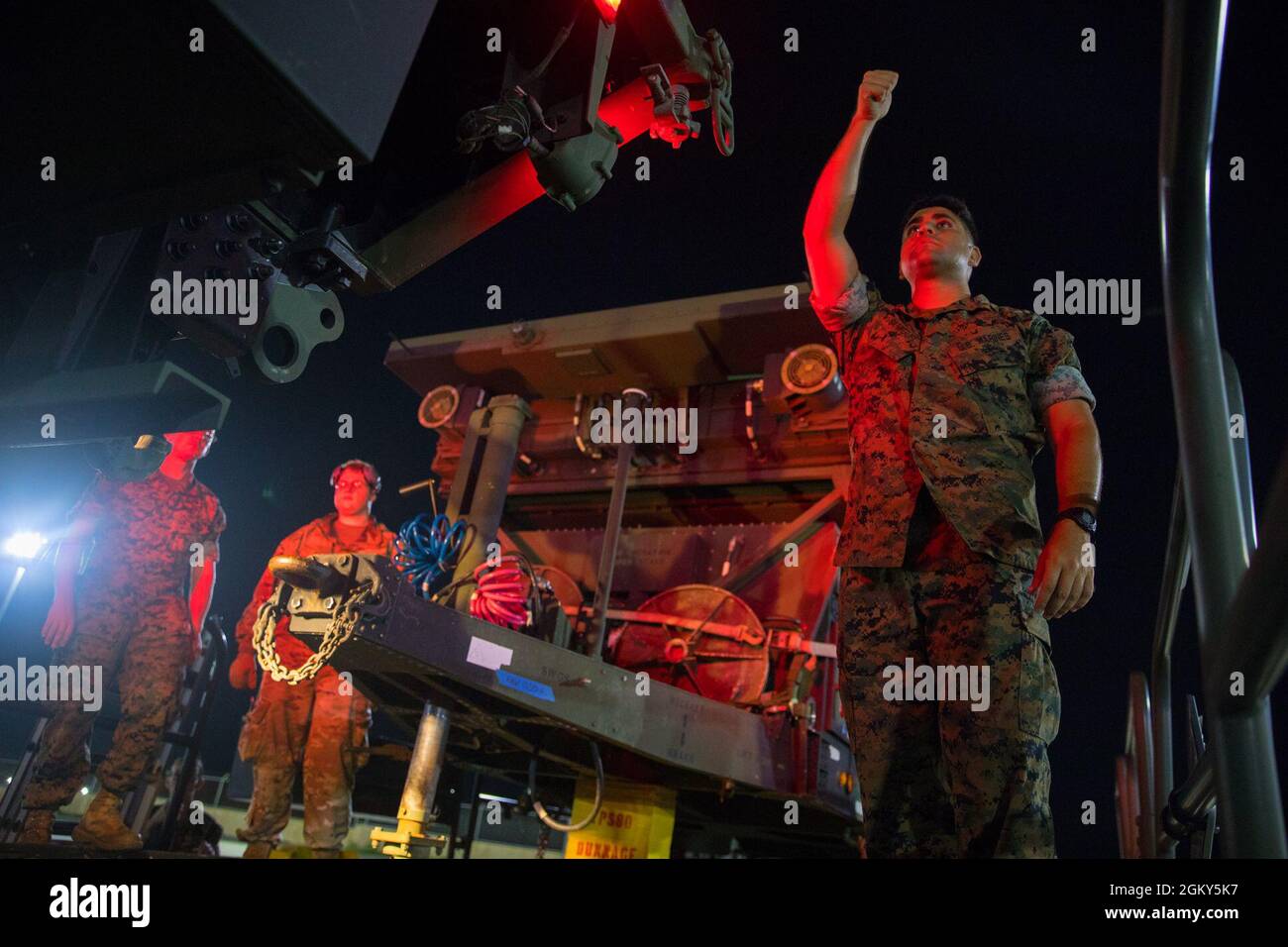 U.S. Marines and Airmen unload an AN/TPS-80 Ground/Air Task Oriented ...