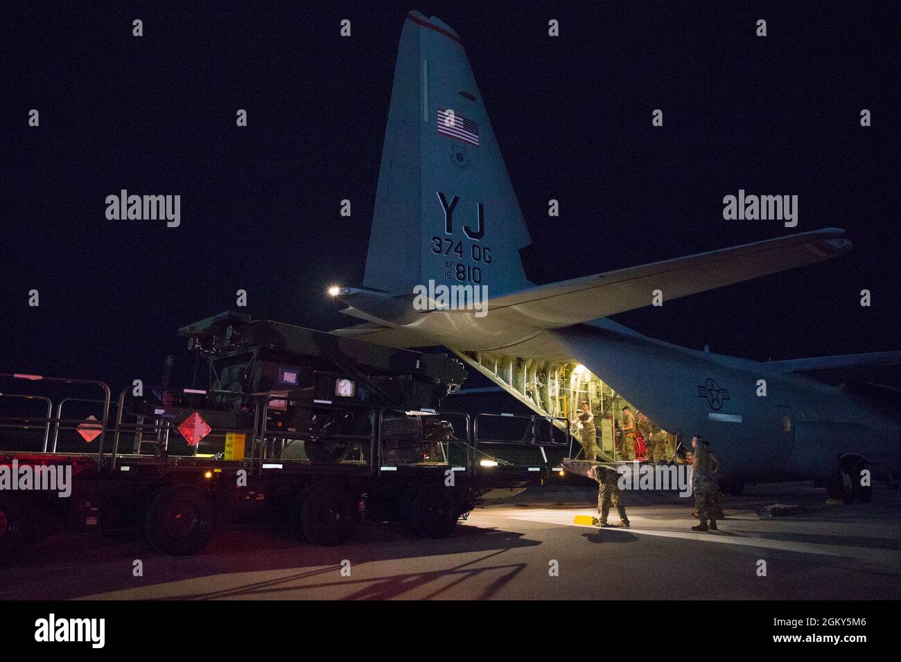 U.S. Marines and Airmen unload an AN/TPS-80 Ground/Air Task Oriented ...