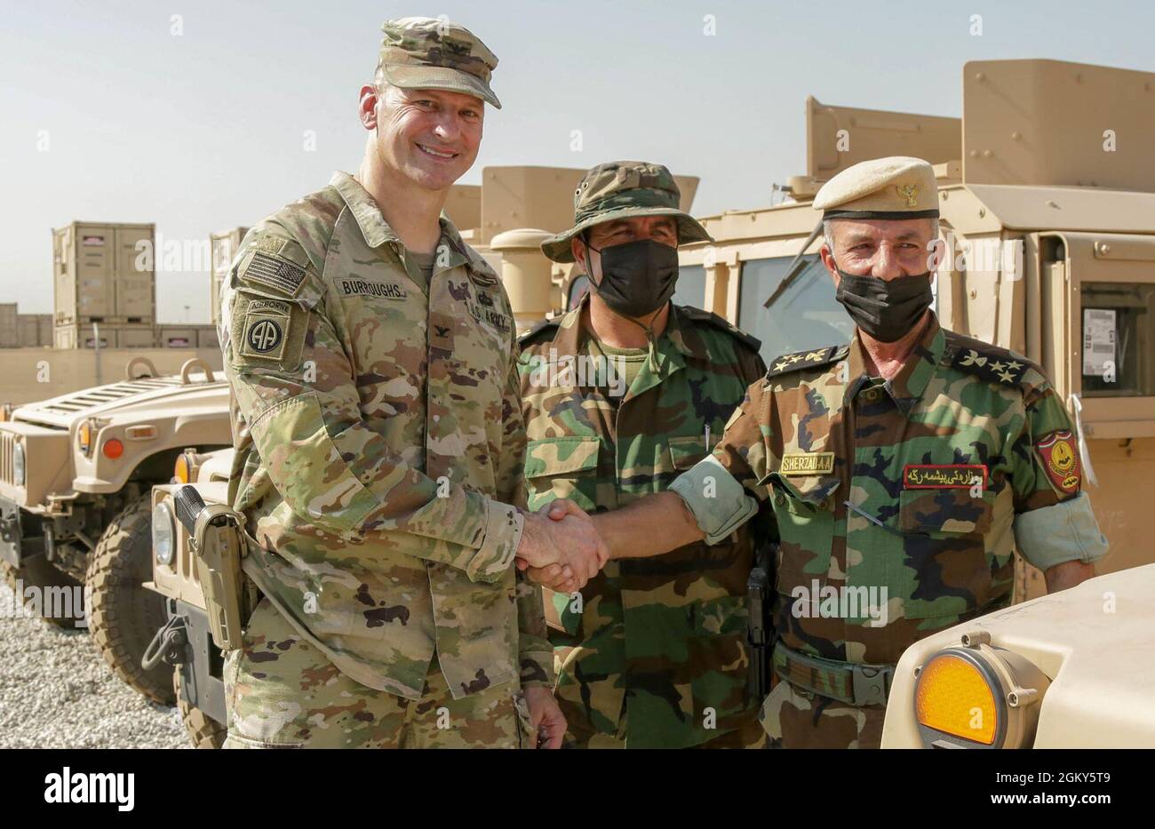 U.S. Army Colonel Todd Burroughs and Brigadier General Sherzad pose for ...