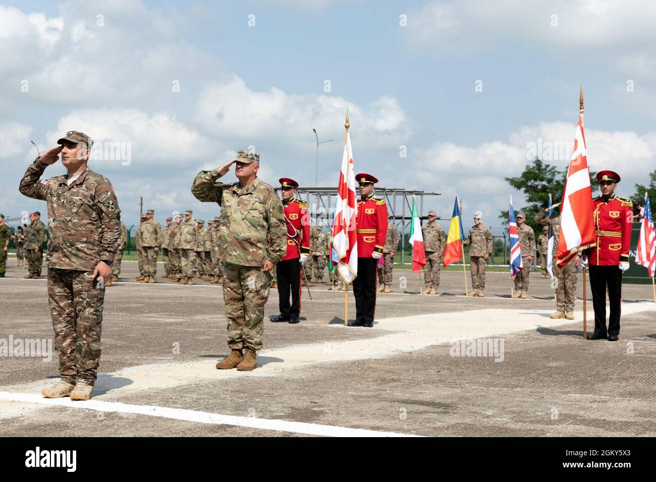 Soldiers attending Exercise Agile Spirit 2021 salute during a ceremony ...