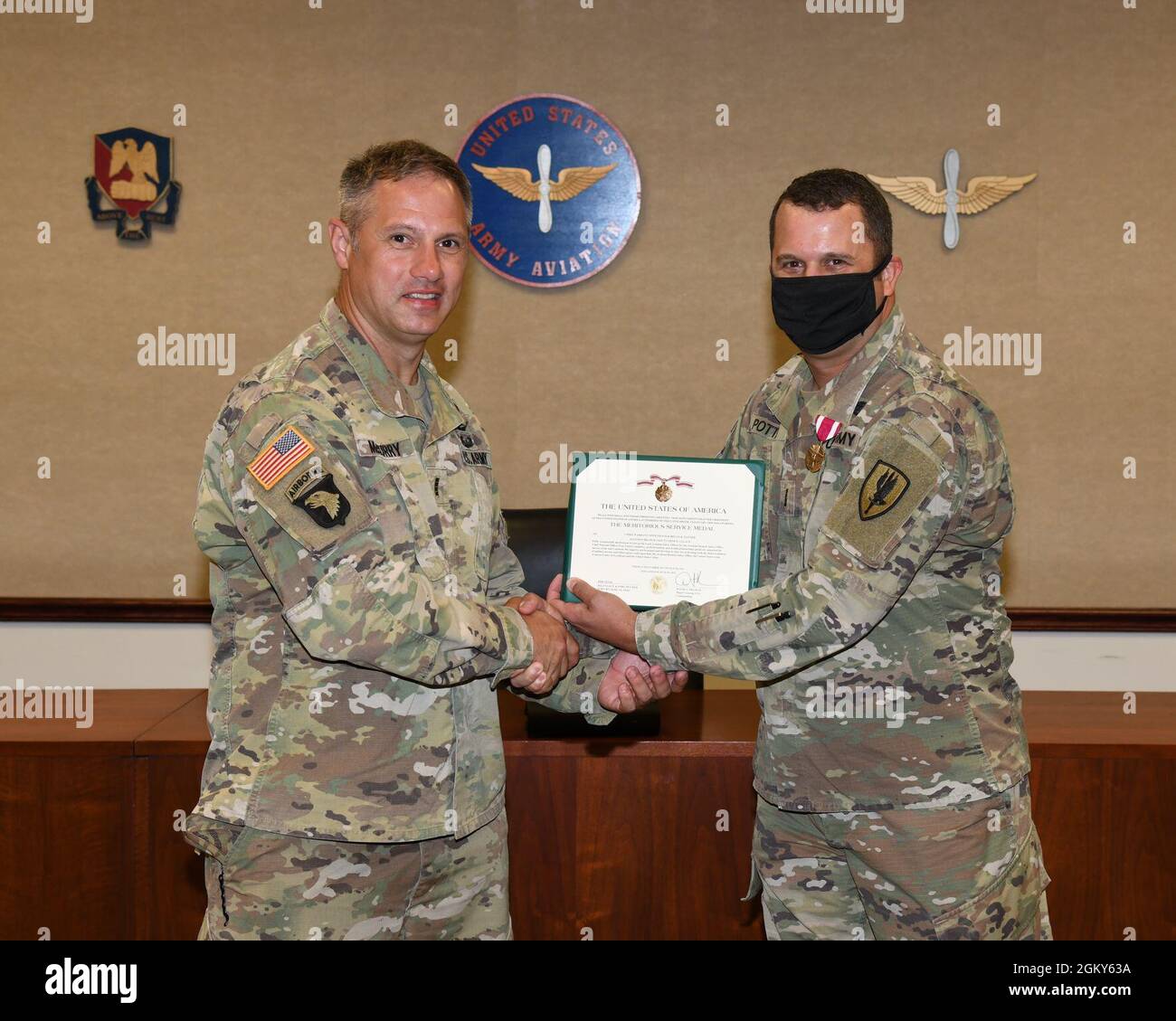 U.S. Army Chief Warrant Officer 4 Bryan K. Potter receives the ...