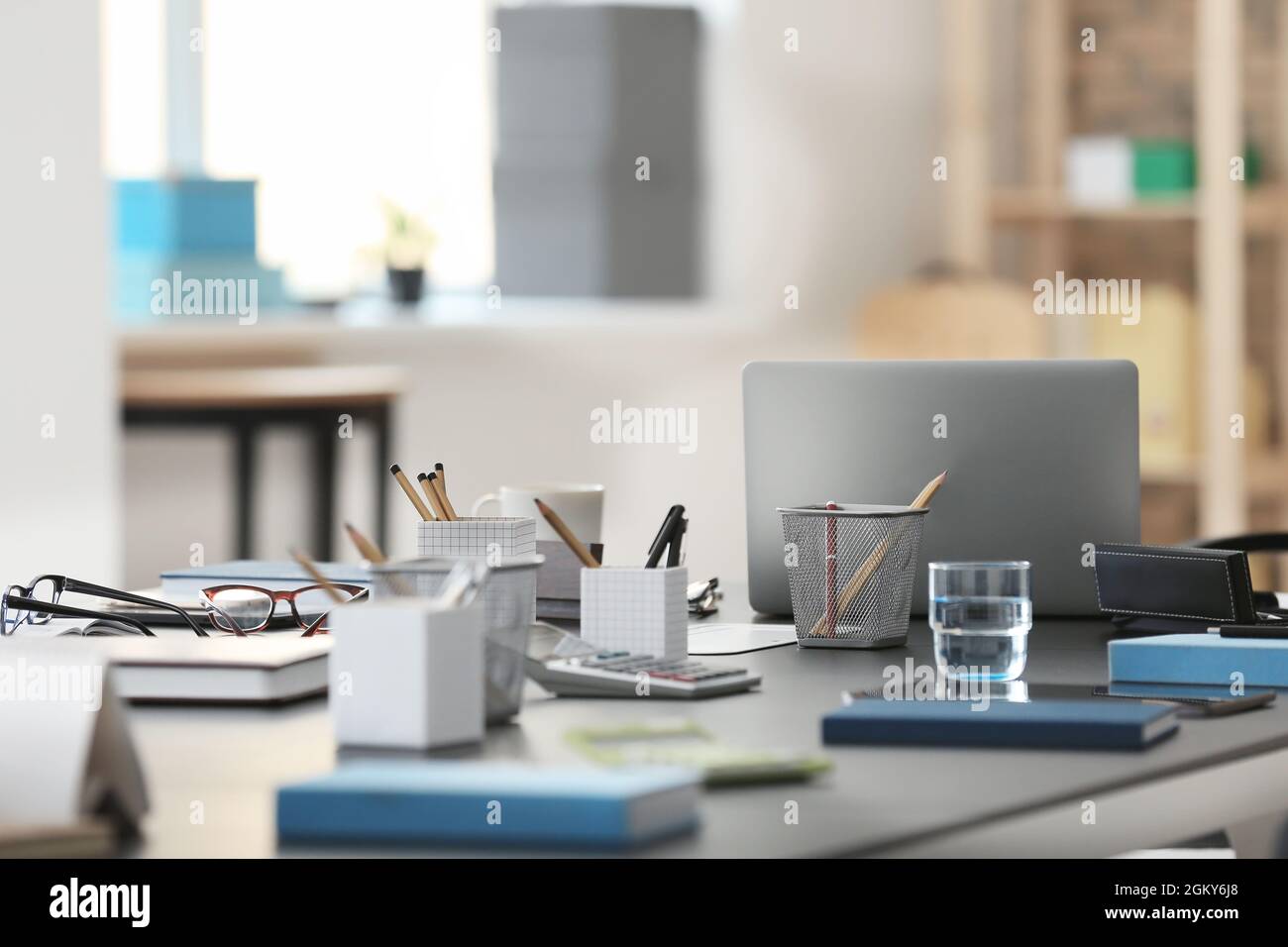 Table with modern laptop and stationery in office Stock Photo - Alamy