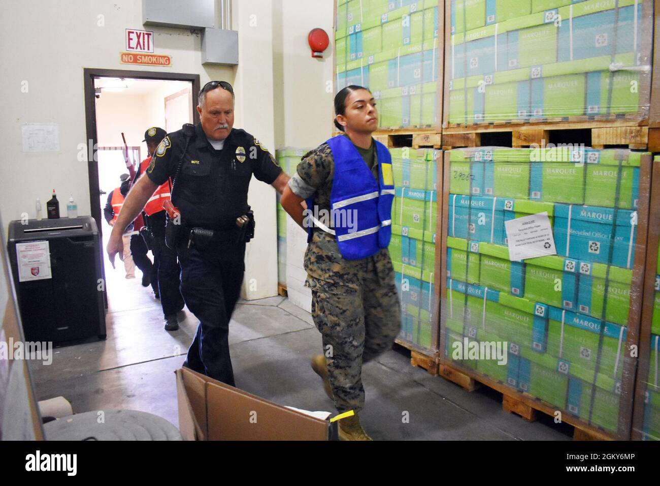 Sgt. John Butz of the Presidio of Monterey Police Department escorts ...