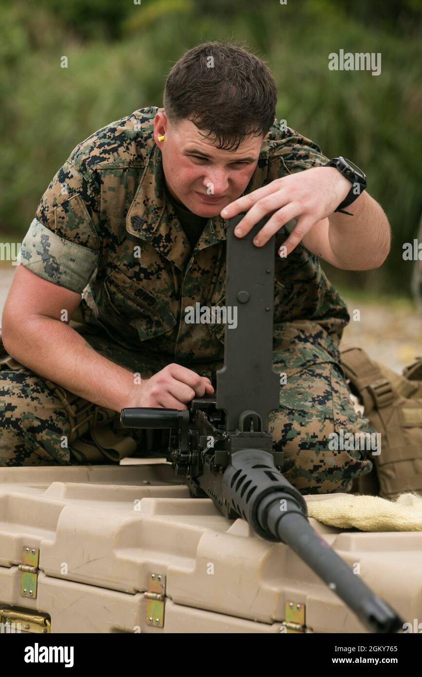 U.S. Marine Corps Sgt. Jeremy Sims, a small arms technician with 3d ...