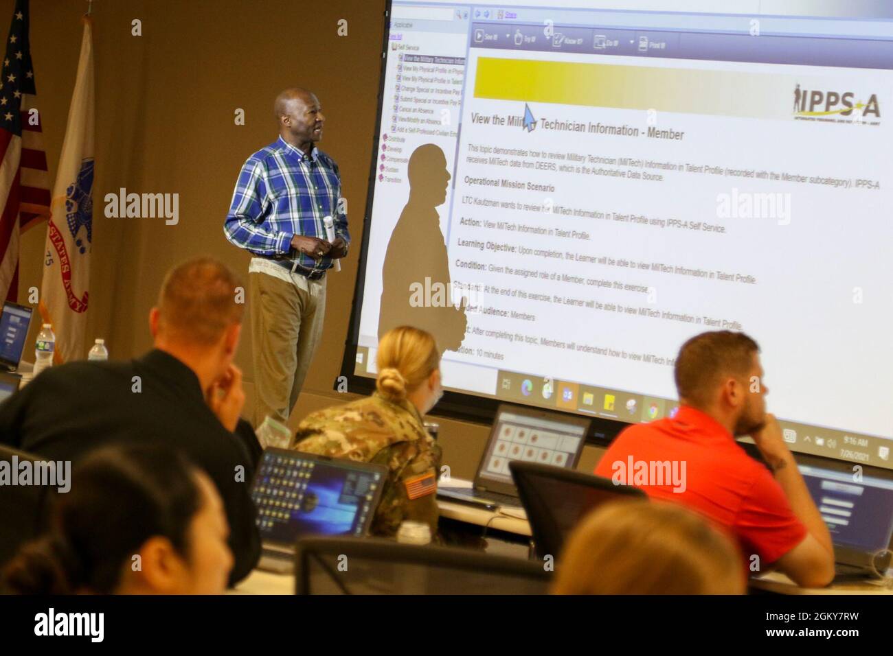 William Hepburn, standing, a training instructor with the Integrated ...