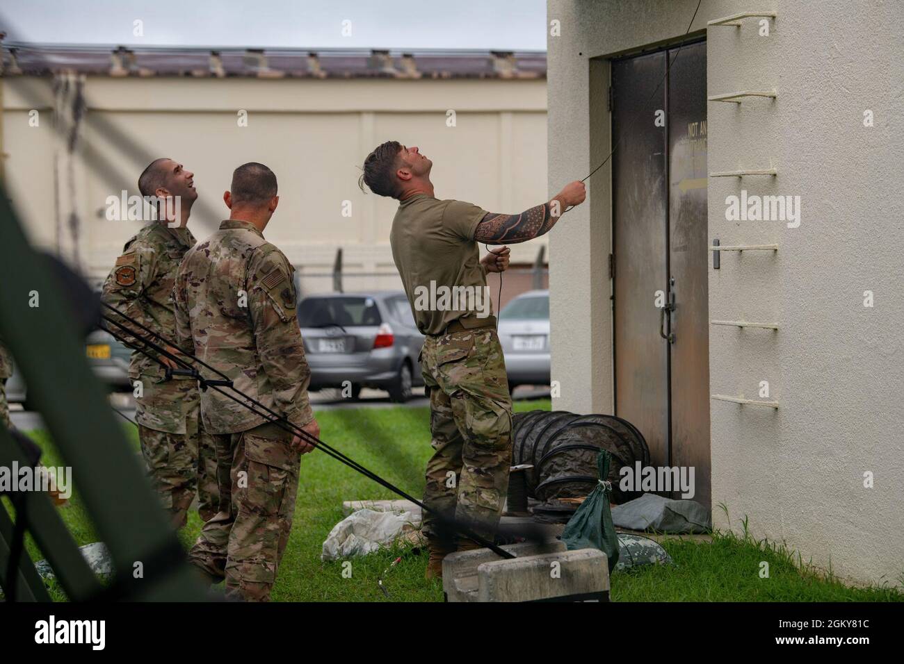 U.S. Air Force service members assist in setting up antennas for ...