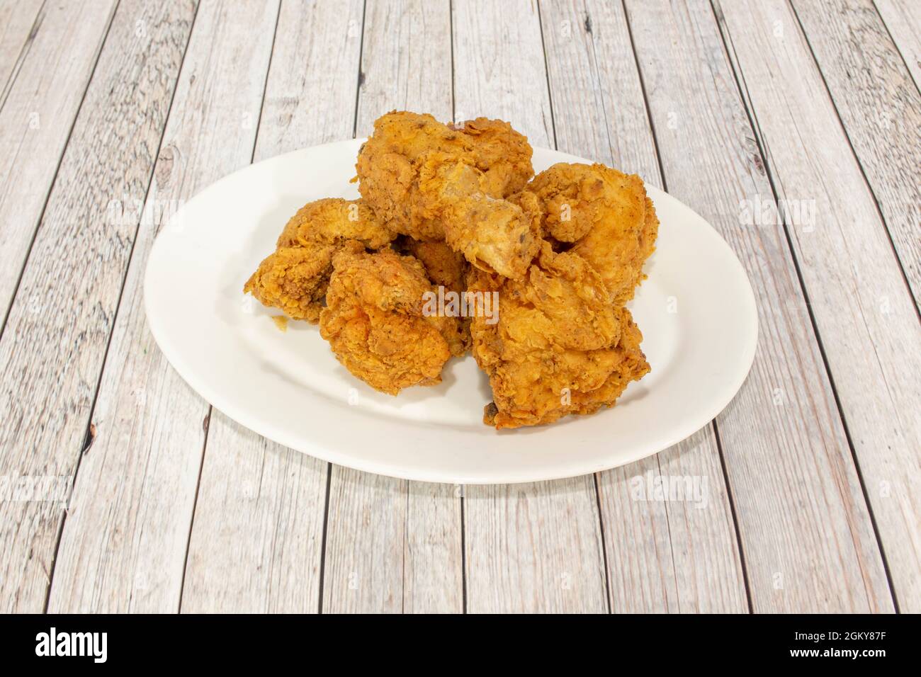 Crispy kentucky broaster chicken pieces on white tray Stock Photo - Alamy
