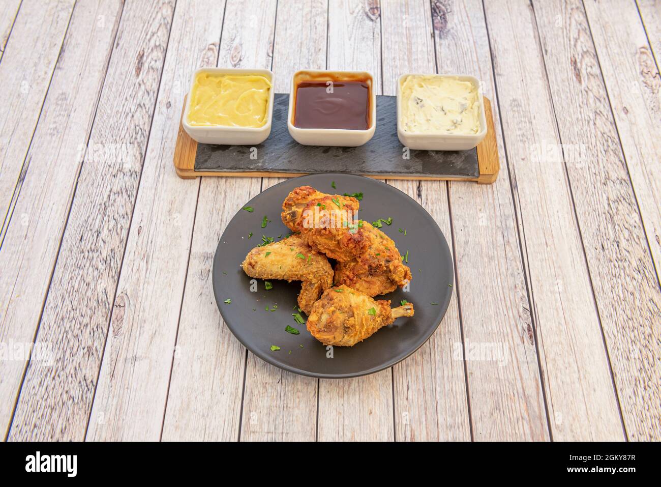 crispy, well toasted broaster chicken spanish tapa with assorted sauces ...