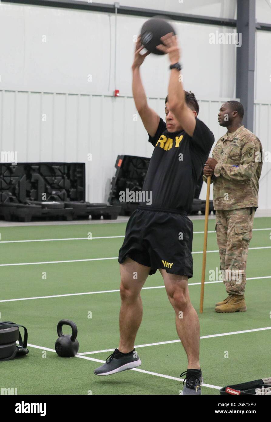 Staff Sgt. Frank Gomes Jr. completes the standing power throw portion ...