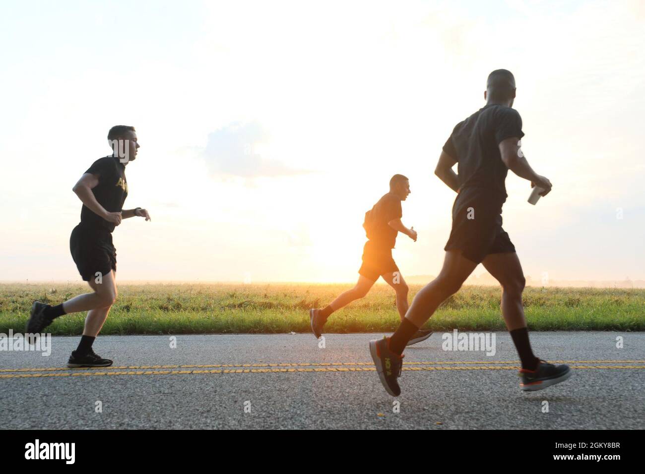 Pfc. Victor Vasquez and Spc. Christian Kerkado-Colon run with Spc ...