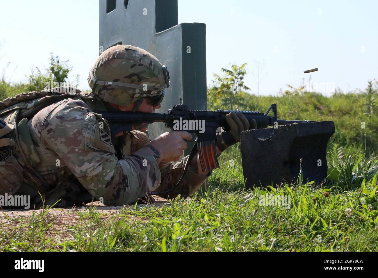 Staff Sgt. Devin Fink fires a M4 during a weapons qualification event ...