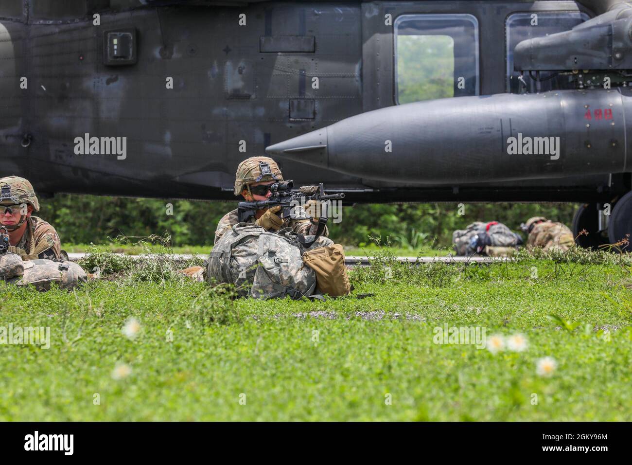 Soldiers participating in Forager 21 pull security after exiting the UH ...