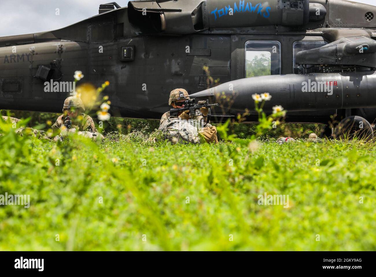 Soldiers participating in Forager 21 pull security after exiting the UH ...
