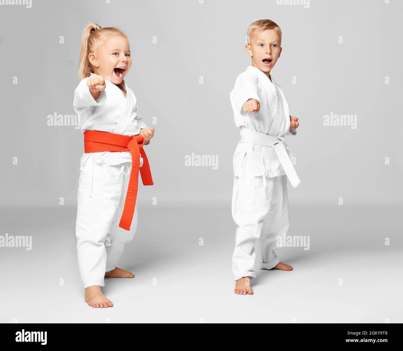 Little children practicing karate on light background Stock Photo - Alamy