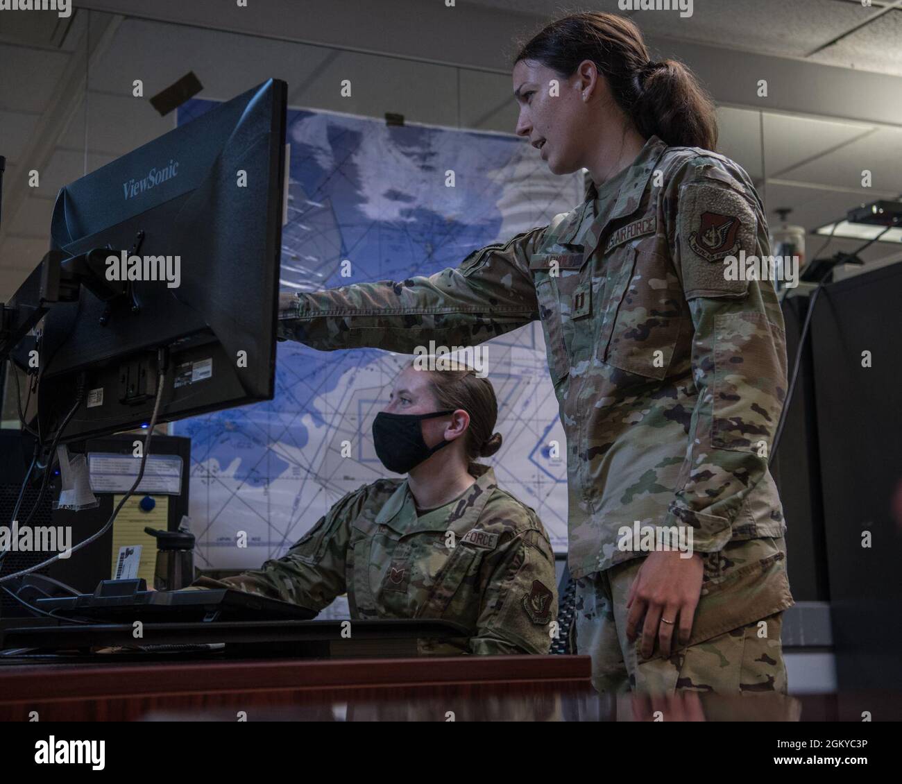 U.S. Air Force Capt. Veronica Arnold, right, 18th Operations Support ...