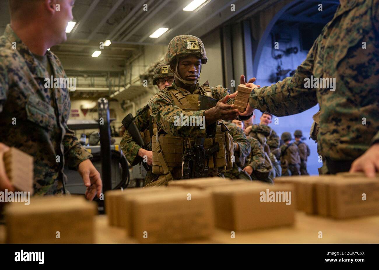 U.S. Marines with 31st Marine Expeditionary Unit (MEU) are handed ...