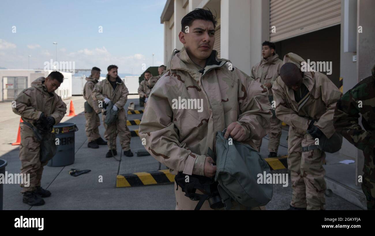 U.S. Marines with Marine Aviation Logistics Squadron 12 remove their ...
