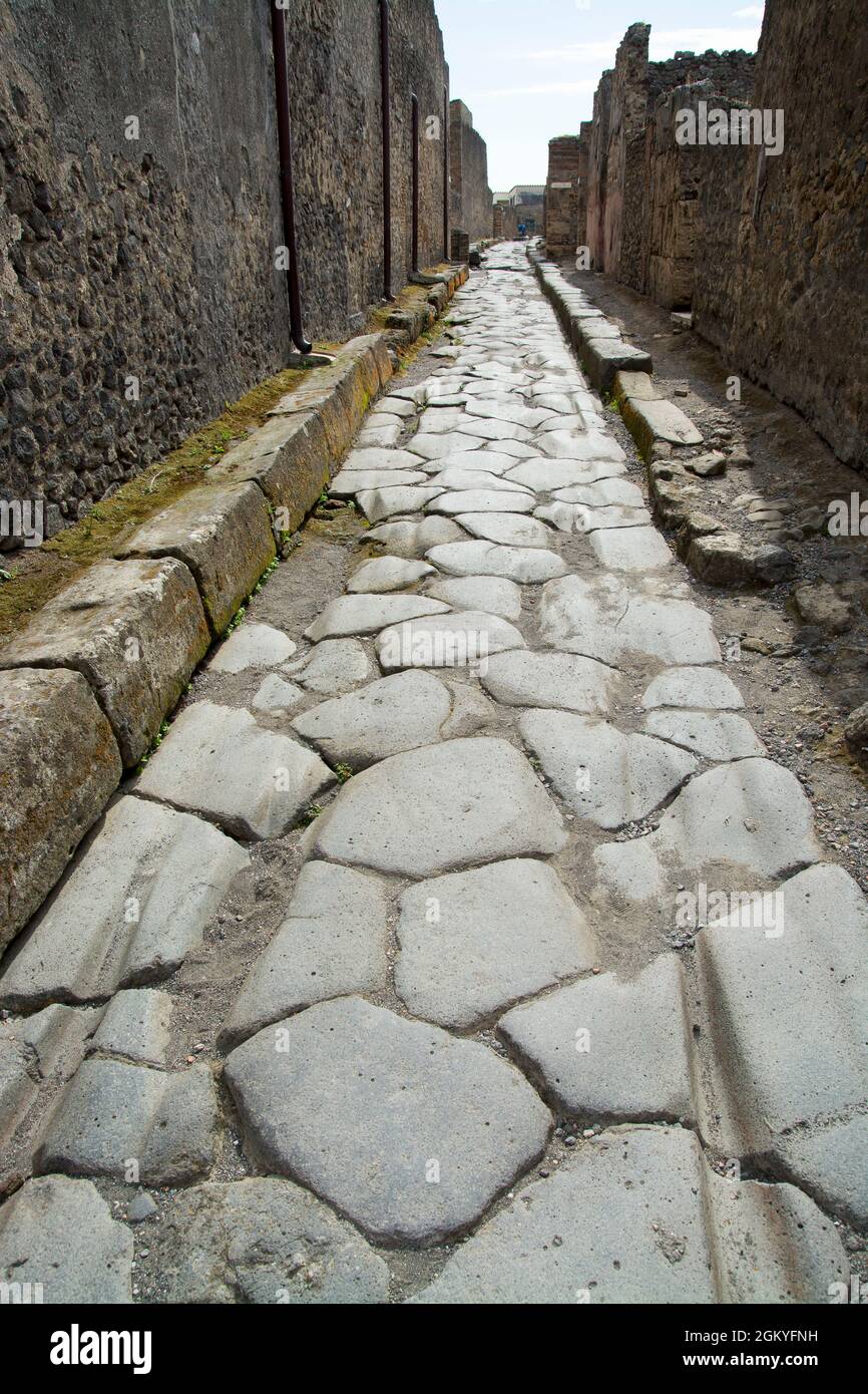 Ancient stone road at Pompei archeological site, Naples, Italy Stock ...