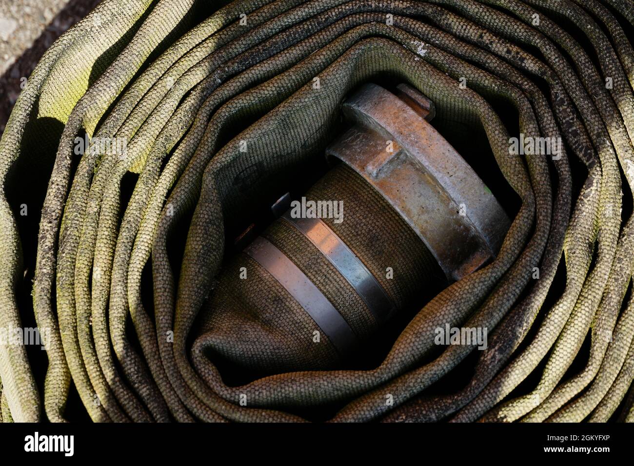 Closeup shot of a rolled fire hose under the sunlight Stock Photo - Alamy