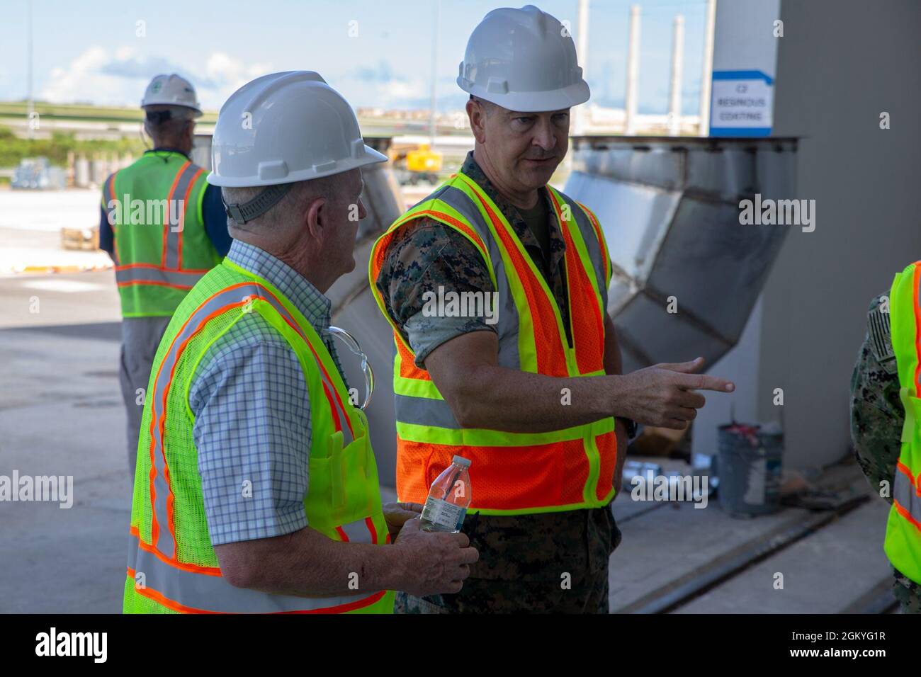 Lt. Col. Tate Buntz, the Marine Corps Base (MCB) Camp Blaz Operations Officer, right, briefs ...