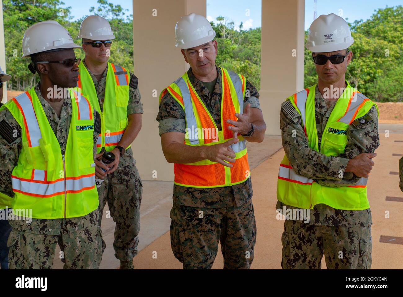 Lt. Col. Tate Buntz, the Marine Corps Base (MCB) Camp Blaz Operations Officer, center, briefs ...