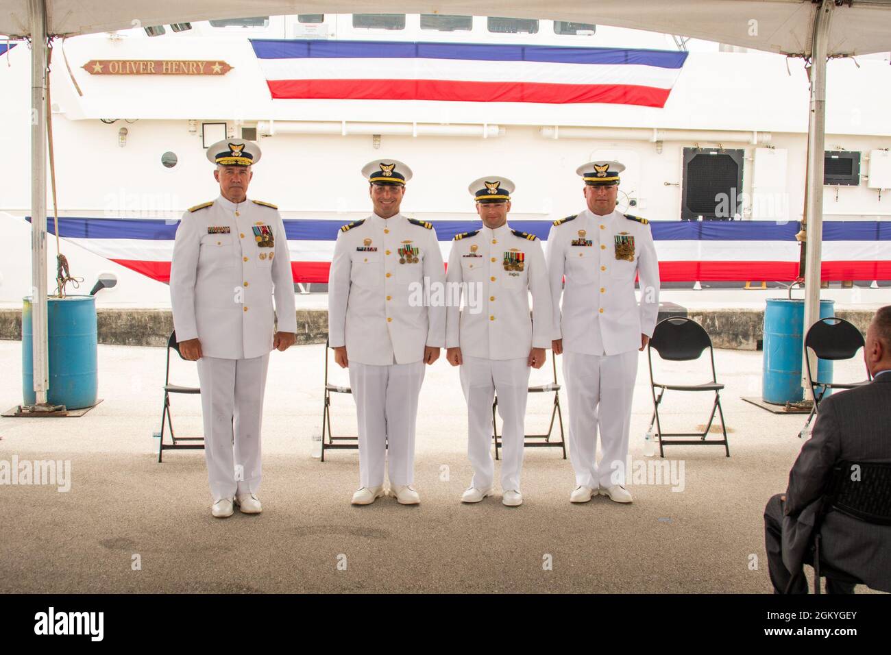 Adm. Karl Schultz, the commandant of the Coast Guard, stands with the ...