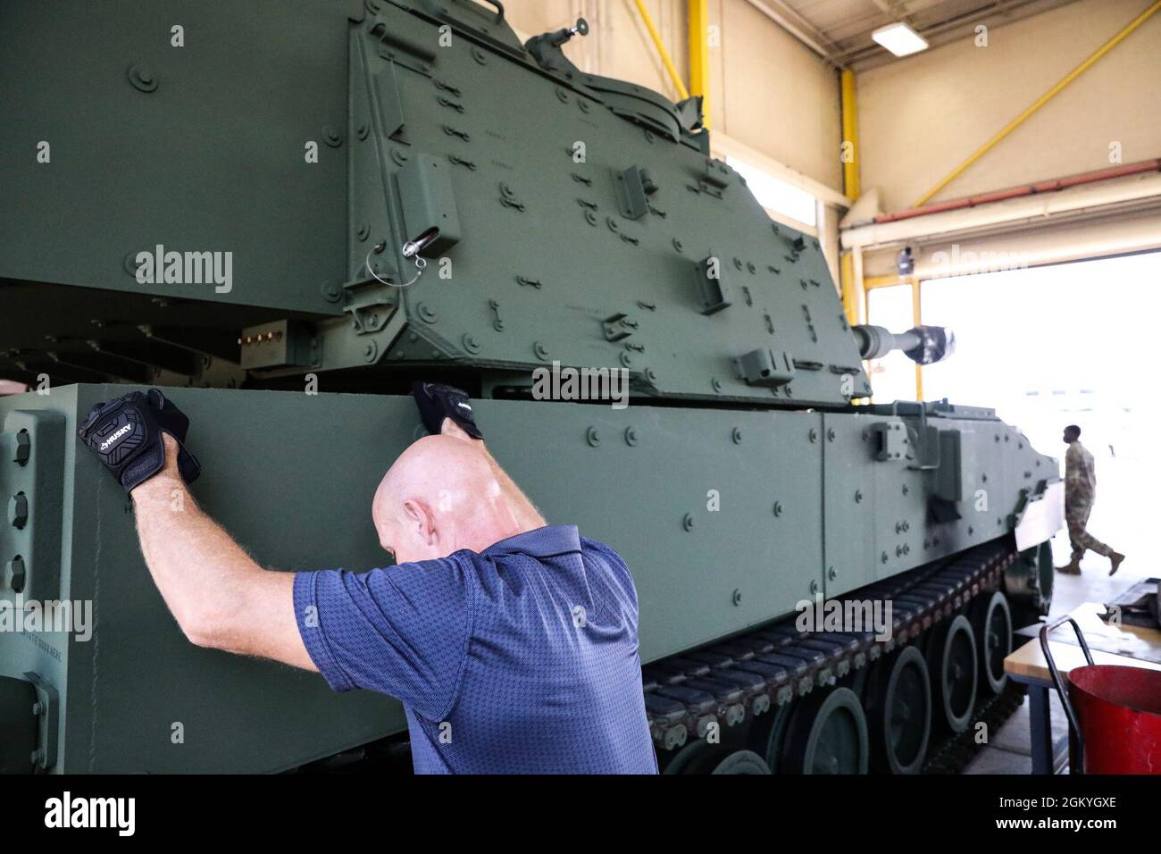 Department of Defense civilian inspect an M992A3 Carrier Ammunition ...